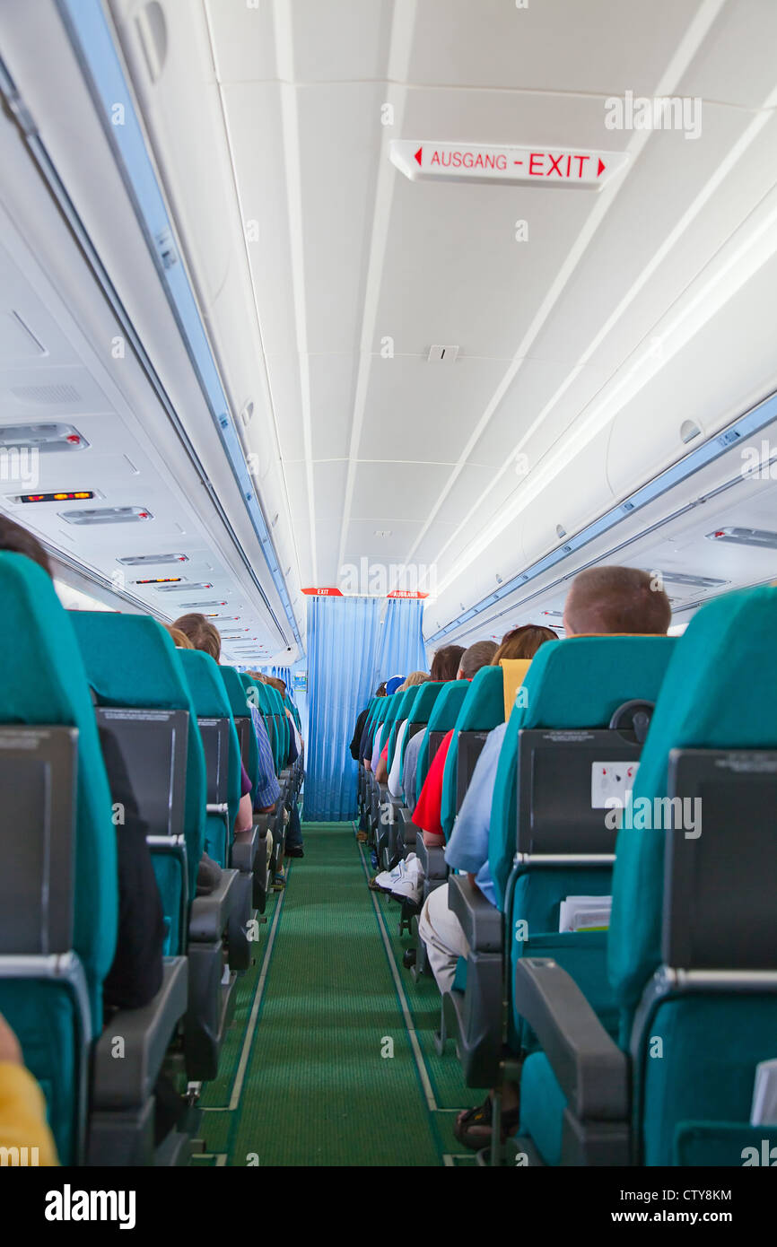 Aircraft cabin after take off Stock Photo - Alamy