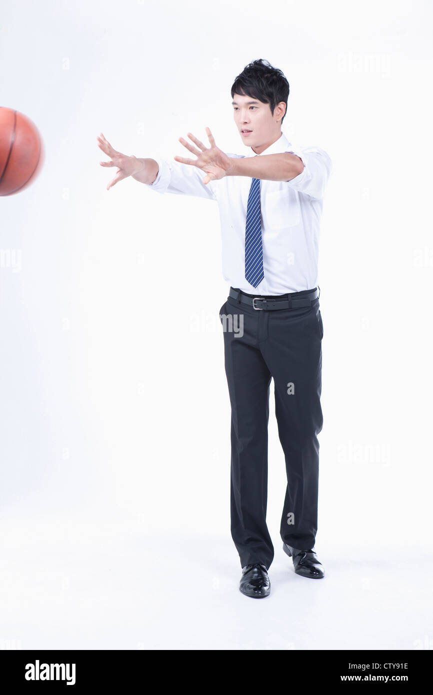 A man passing a basketball Stock Photo - Alamy