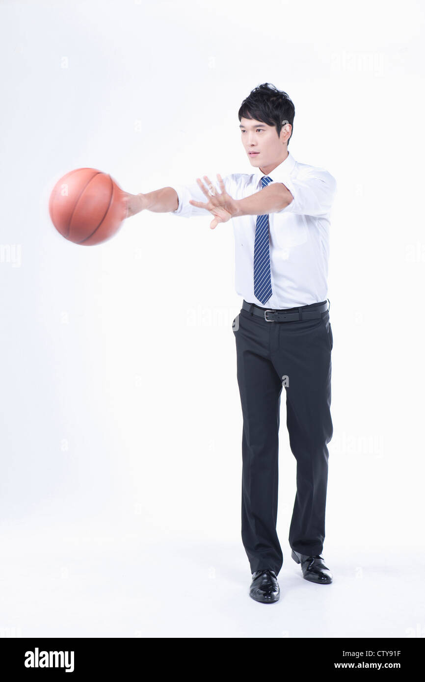 A man passing a basketball Stock Photo - Alamy