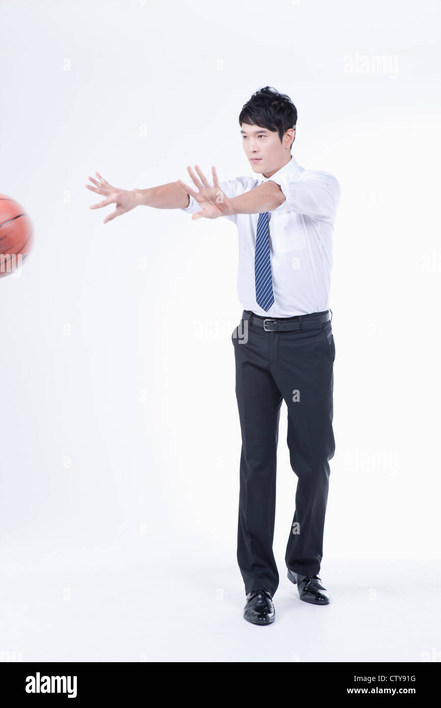 A man passing a basketball Stock Photo - Alamy