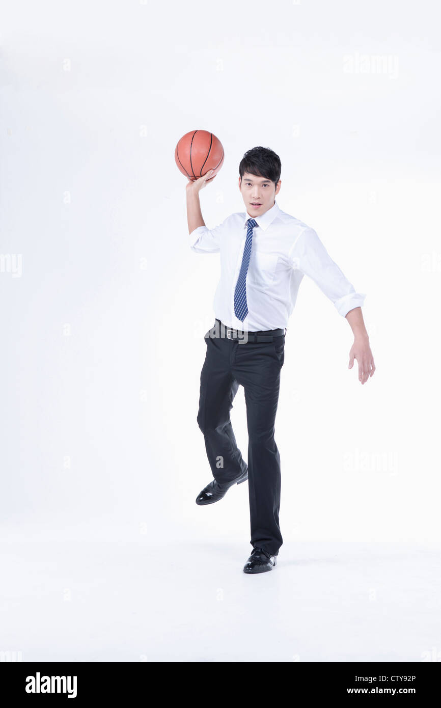 A man throwing a basketball Stock Photo - Alamy