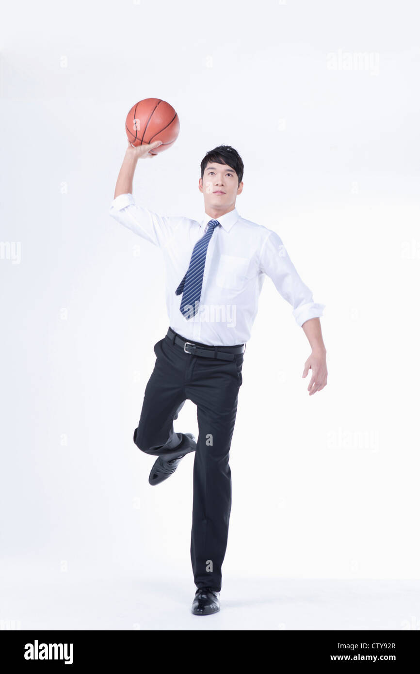 A man throwing a basketball Stock Photo - Alamy