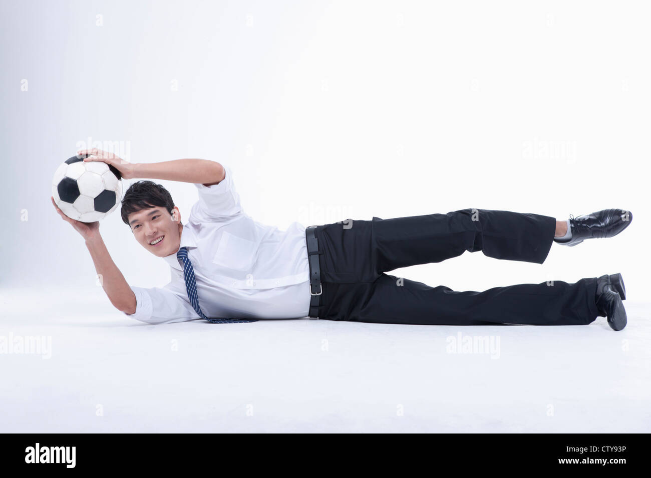 A man catching a soccer ball Stock Photo - Alamy