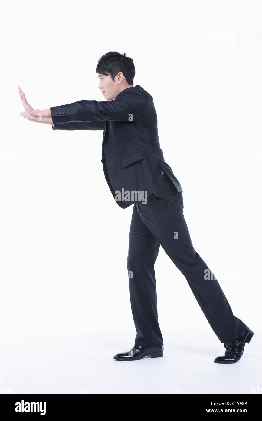 A man pushing on the front Stock Photo - Alamy