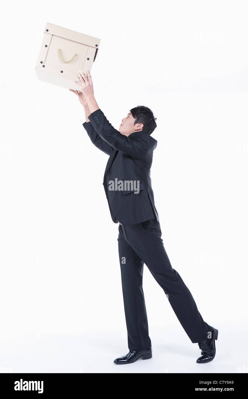 A man putting on the box Stock Photo - Alamy