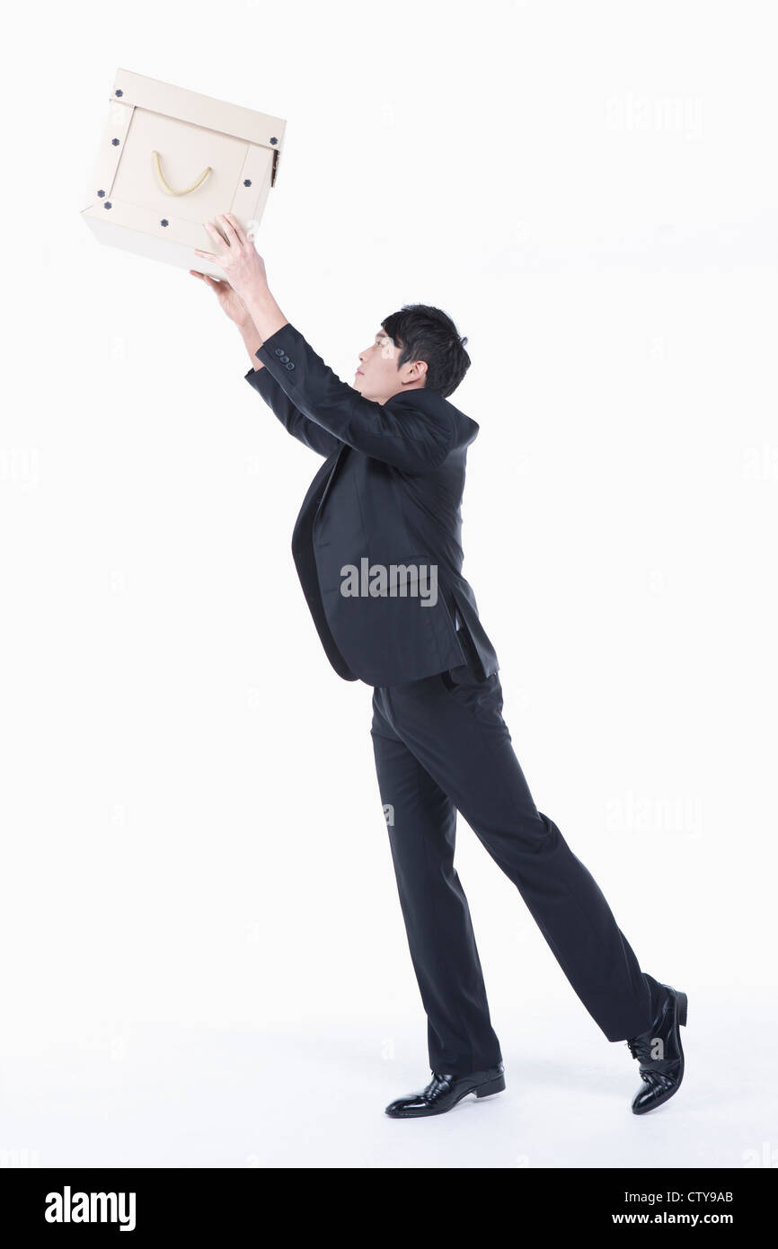 A man putting on the box Stock Photo - Alamy