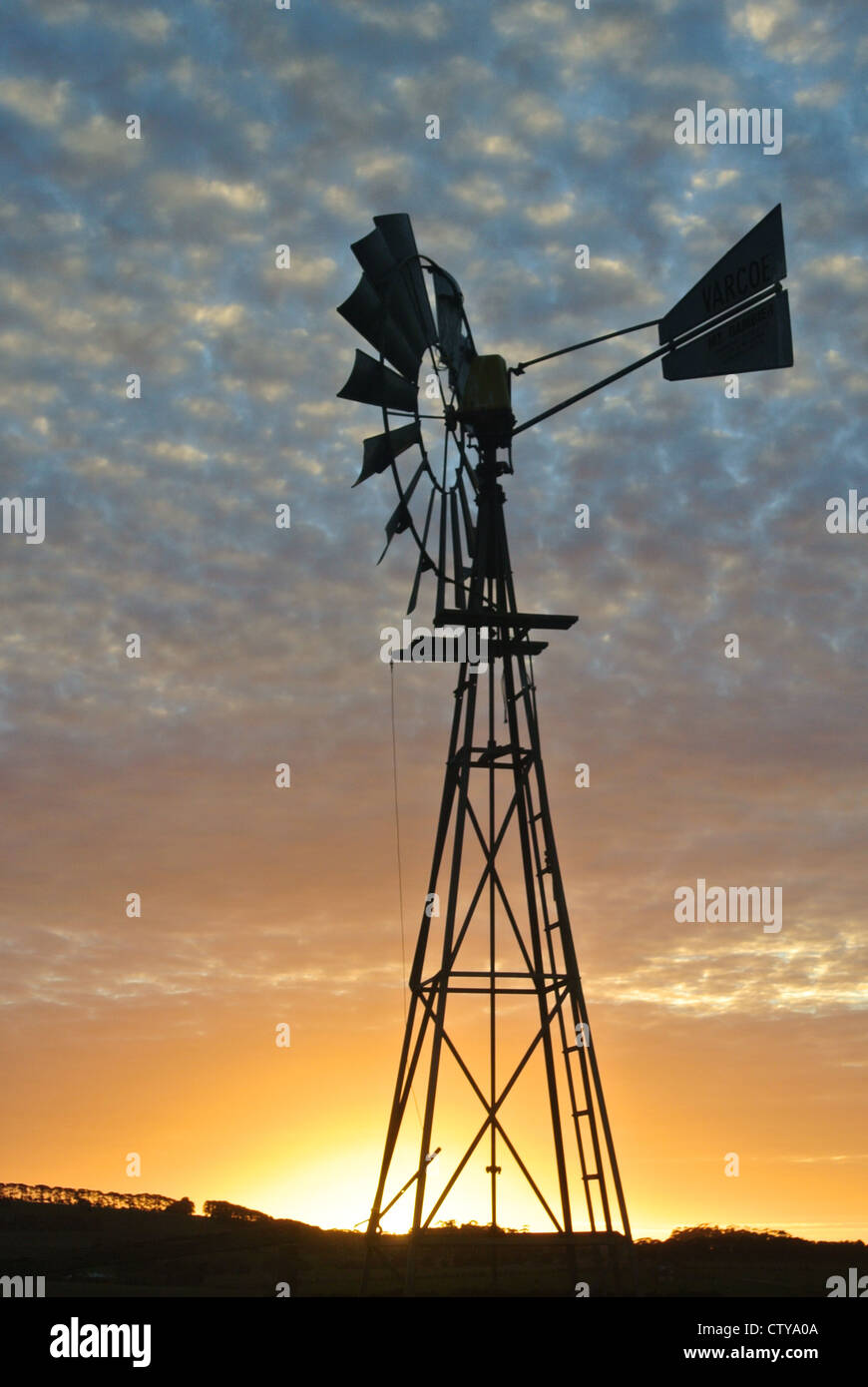 Windmill sunset final grow Stock Photo - Alamy