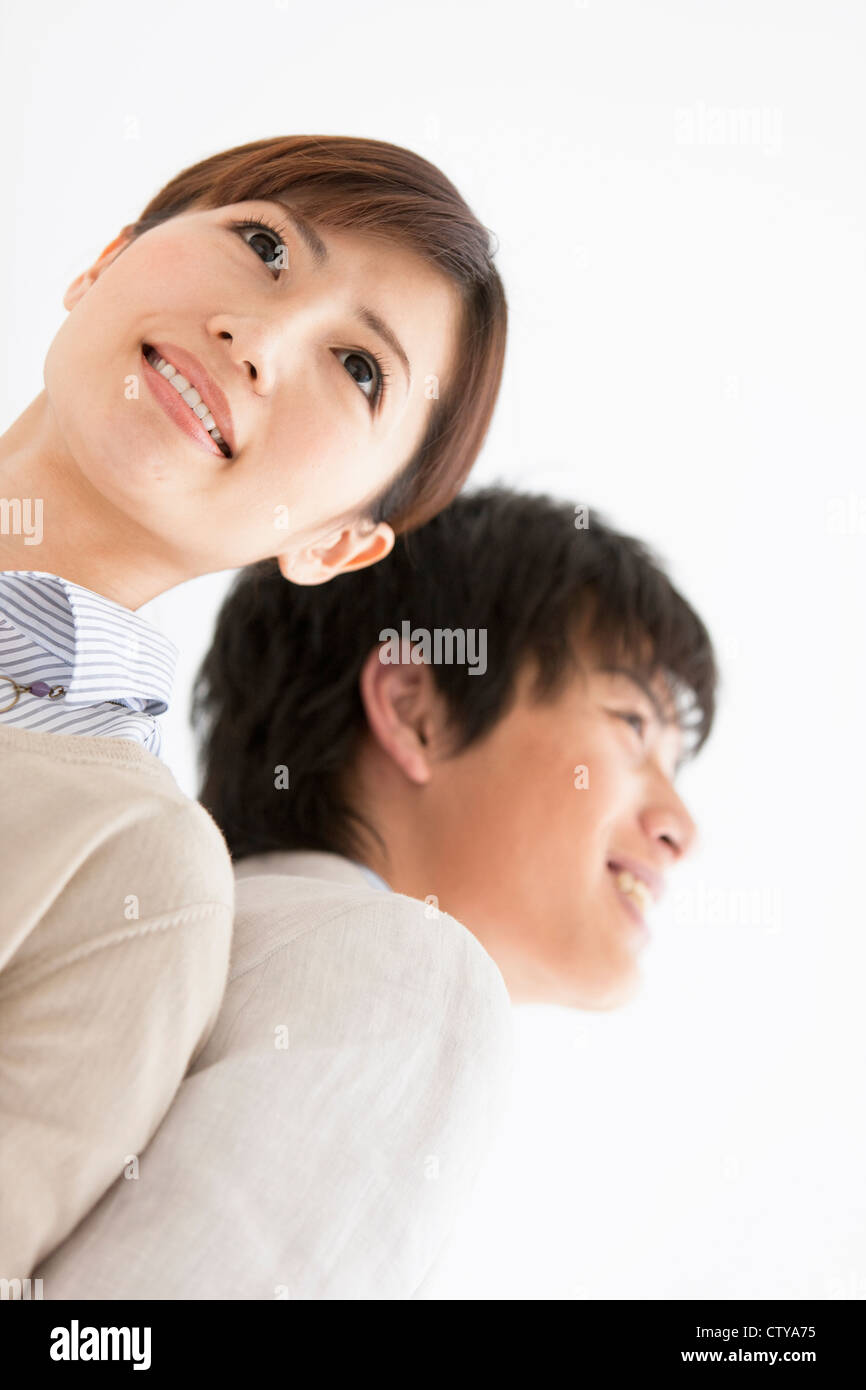 Businesspeople standing back to back Stock Photo - Alamy