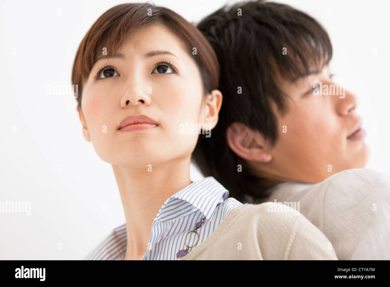 Businesspeople standing back to back Stock Photo - Alamy