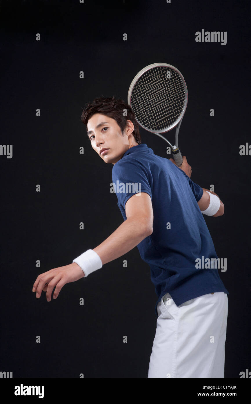 A man playing tennis Stock Photo - Alamy