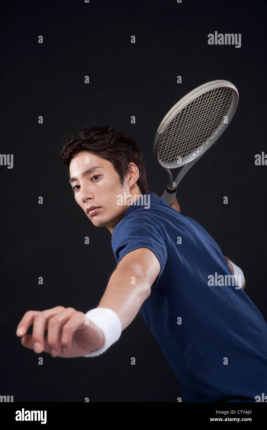 A man playing tennis Stock Photo - Alamy