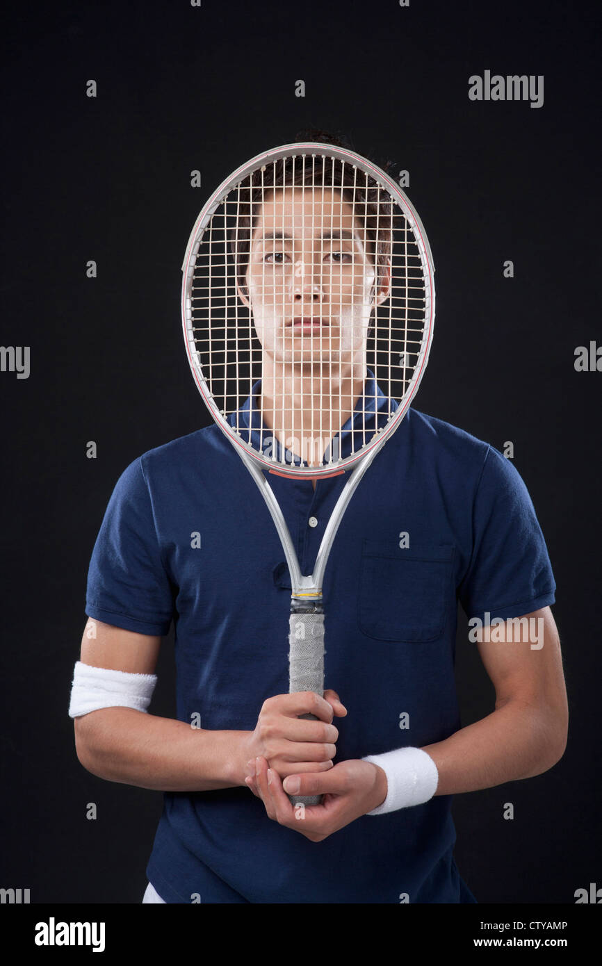 A man with a tennis racket Stock Photo - Alamy
