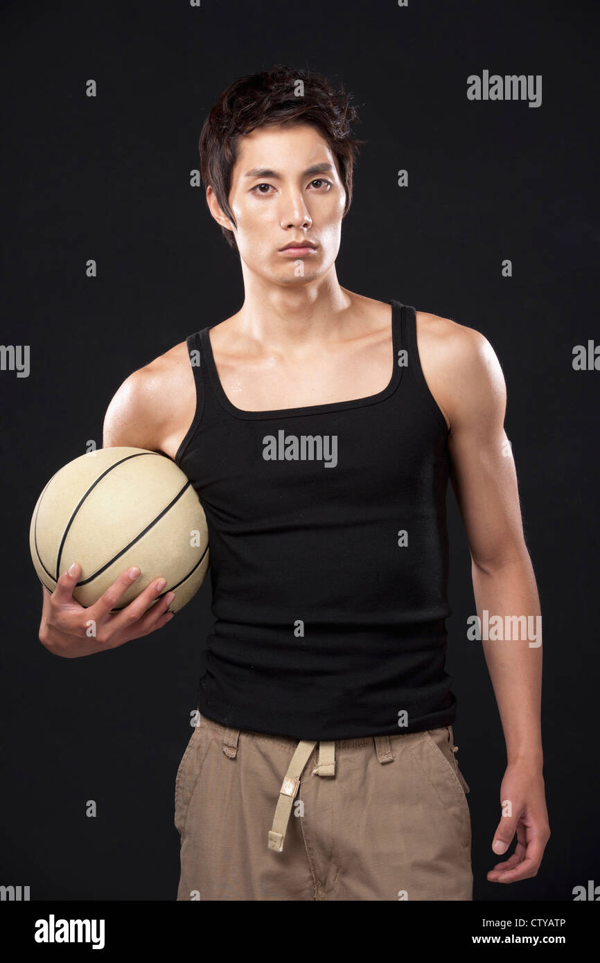 A man with a basketball Stock Photo - Alamy
