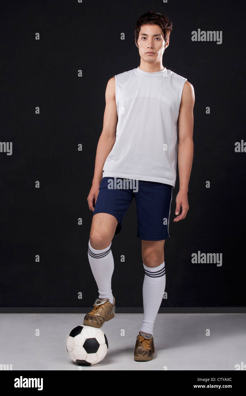 A man playing soccer Stock Photo - Alamy