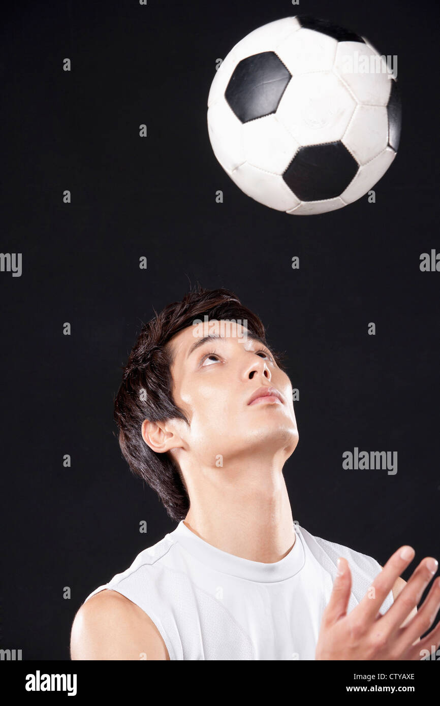A man playing soccer Stock Photo - Alamy