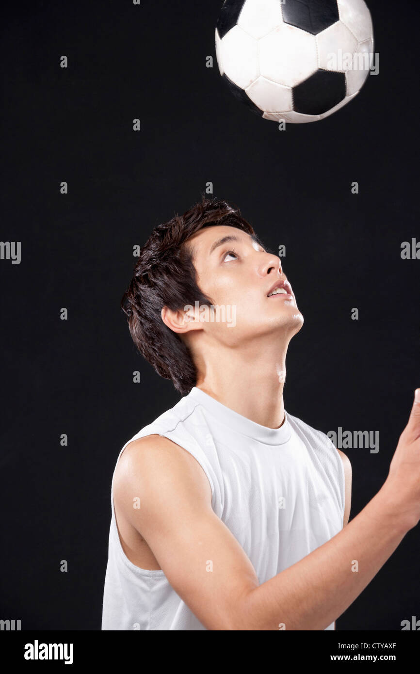 A man playing soccer Stock Photo - Alamy