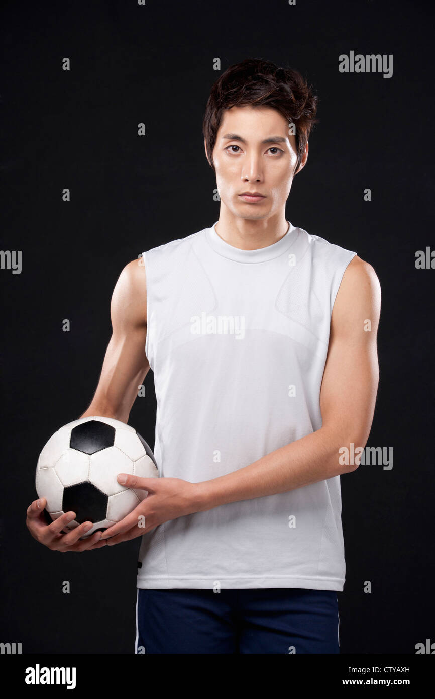 A man with a soccer ball Stock Photo - Alamy