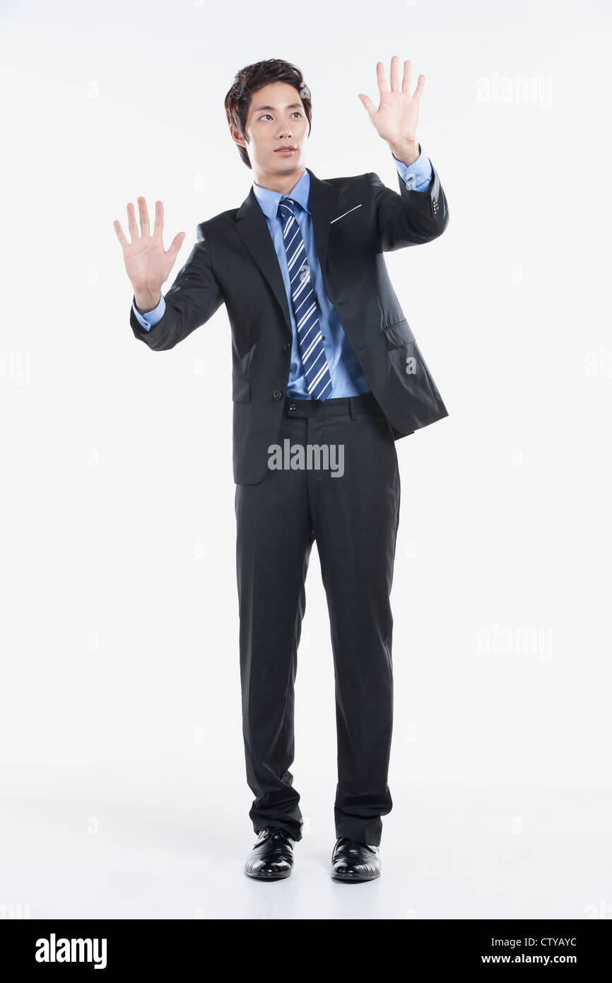 A man touching something with his finger Stock Photo - Alamy