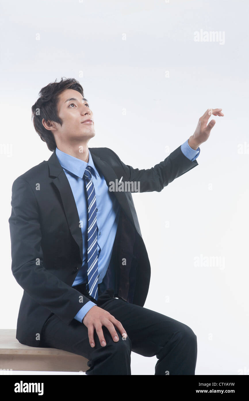 A man reaching his arm Stock Photo - Alamy