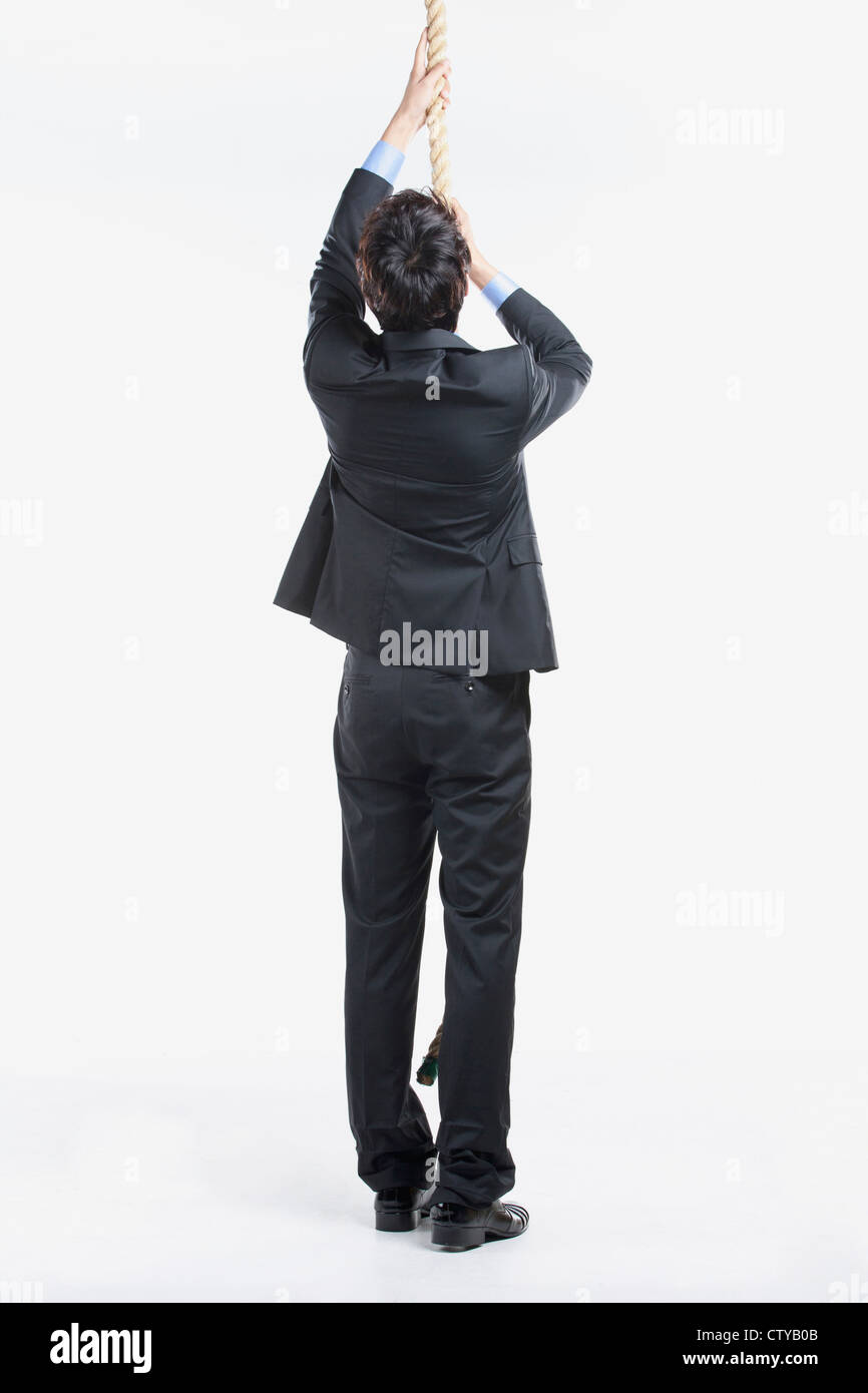 A man holding the rope Stock Photo - Alamy