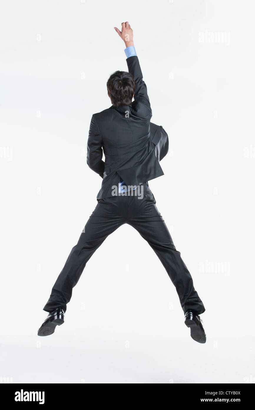 A man trying to catch something Stock Photo - Alamy