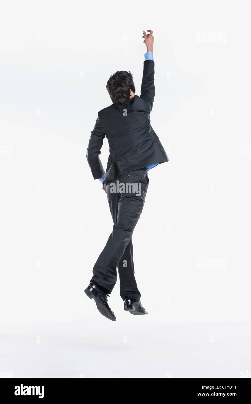 A man trying to catch something Stock Photo - Alamy