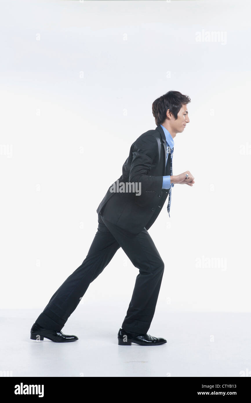 A man pushing something Stock Photo - Alamy
