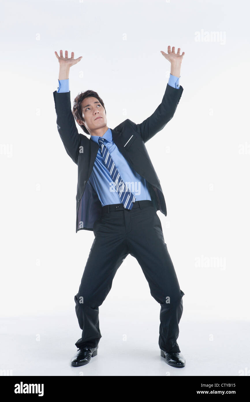 A man holding up the something Stock Photo - Alamy