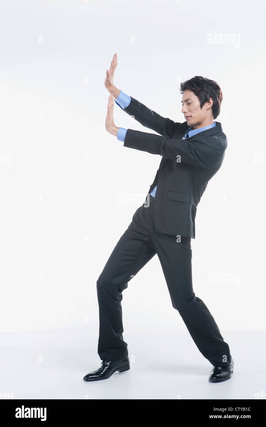 A man pushing something Stock Photo - Alamy