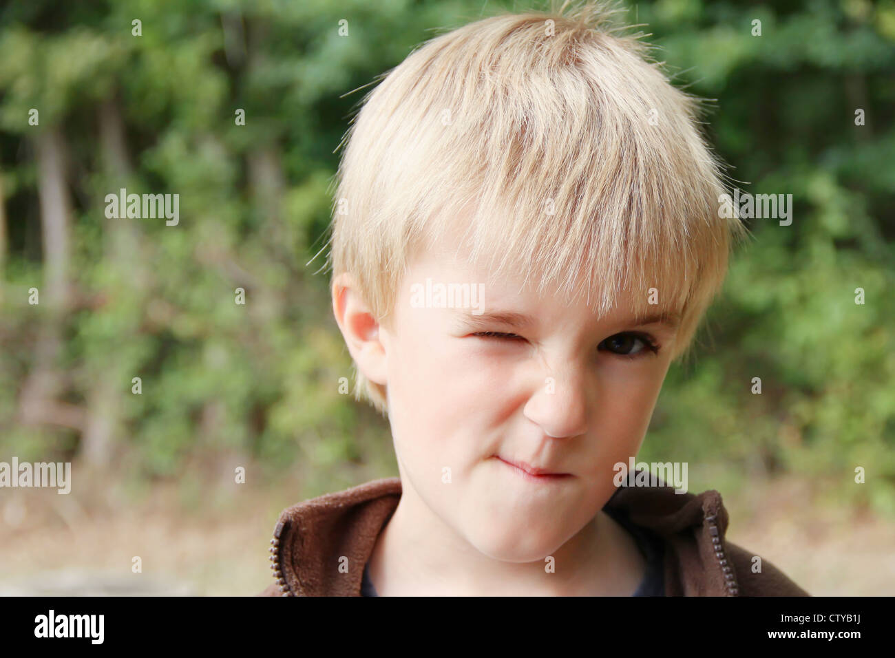 Boy winking hi-res stock photography and images - Alamy