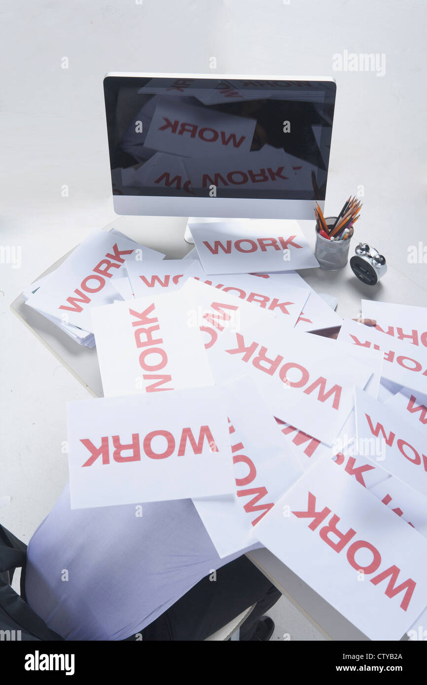 A man under the sheets of paper written work Stock Photo - Alamy