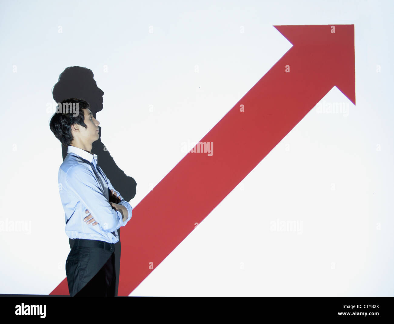 A man with rising chart presentation slide Stock Photo - Alamy