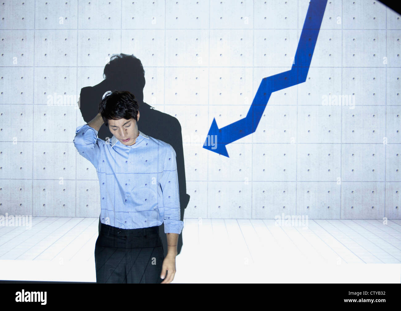 A discouraged man with dropping chart slide Stock Photo - Alamy