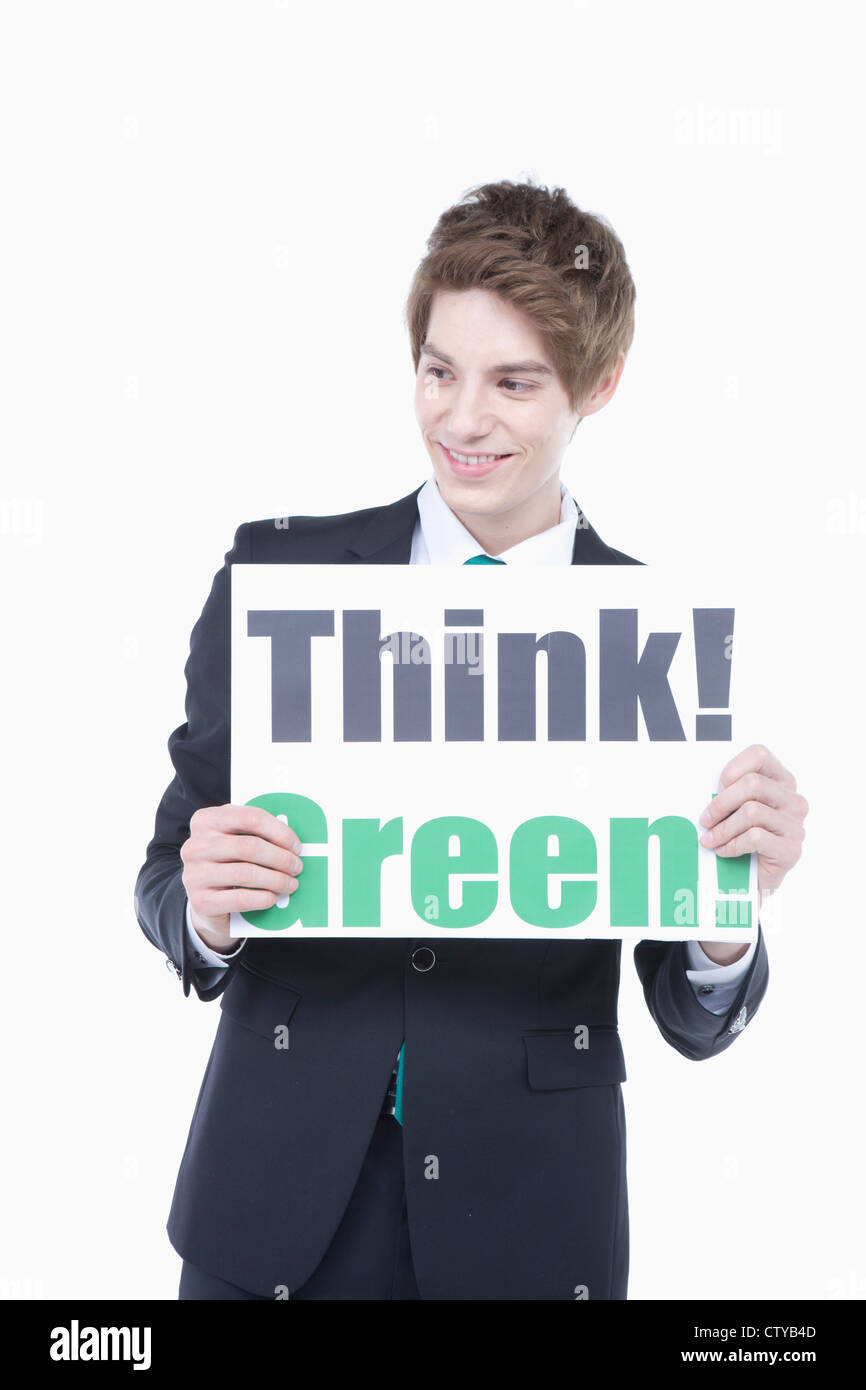 A man holding the Think! Green board Stock Photo - Alamy