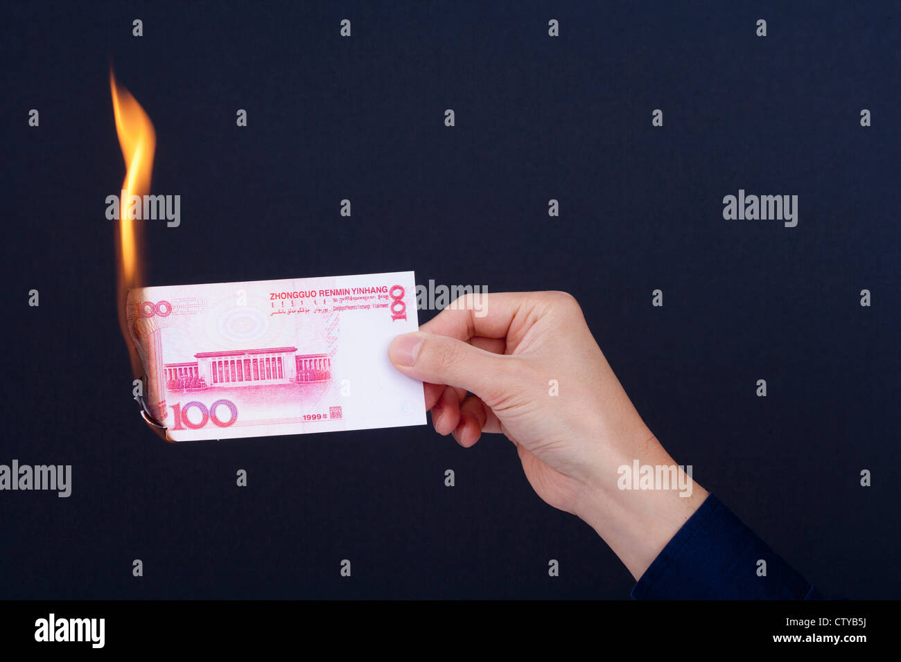 Euro burning on the fire Stock Photo - Alamy