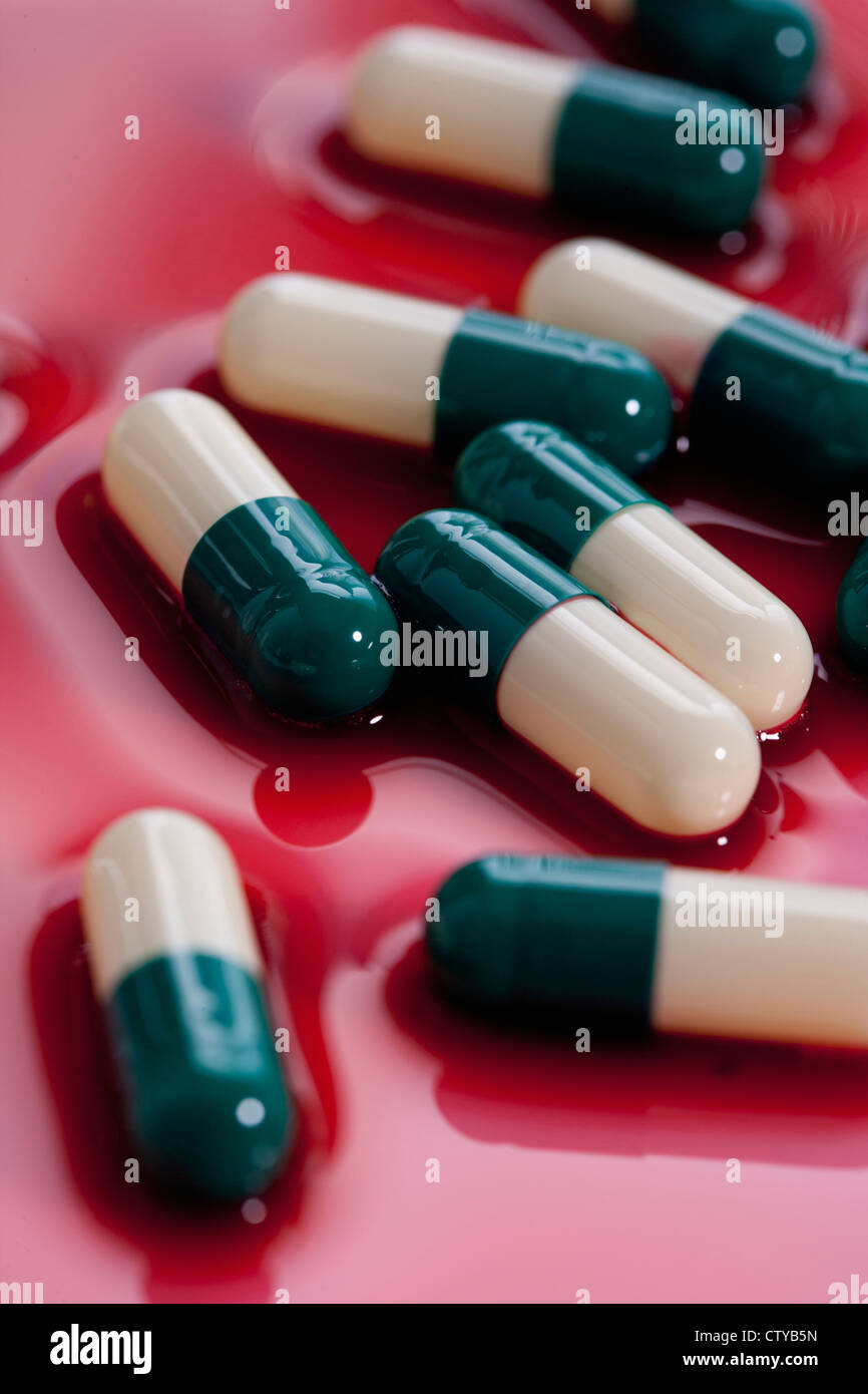 Pills and blood Stock Photo - Alamy