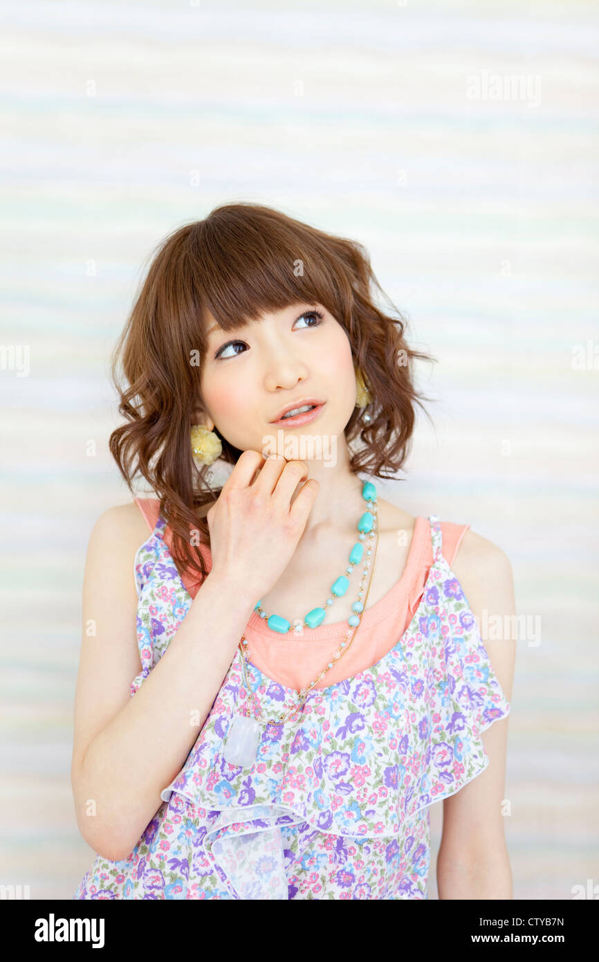 Young woman contemplating Stock Photo - Alamy