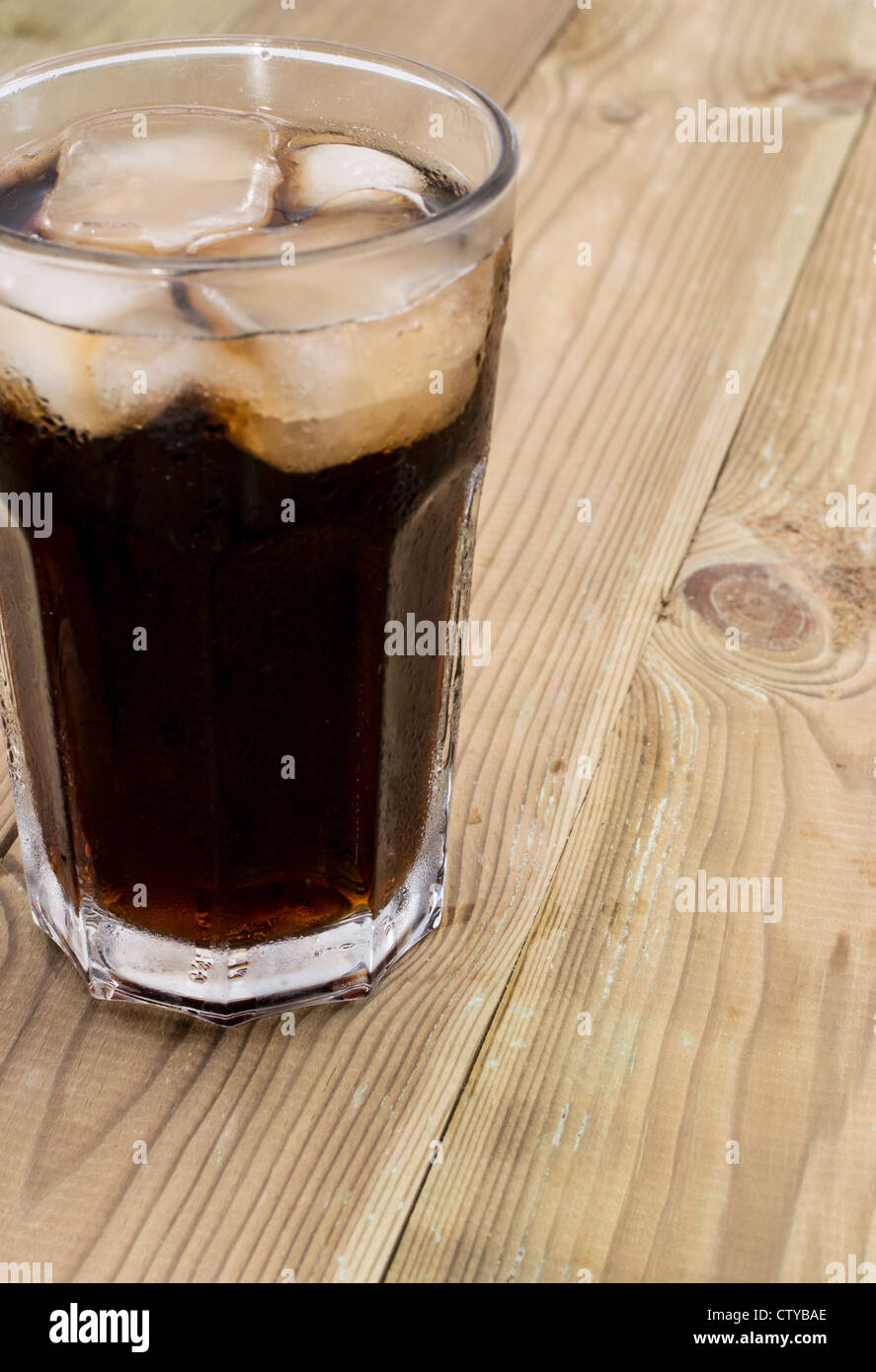 Cold Beverage with ice on wooden background Stock Photo - Alamy