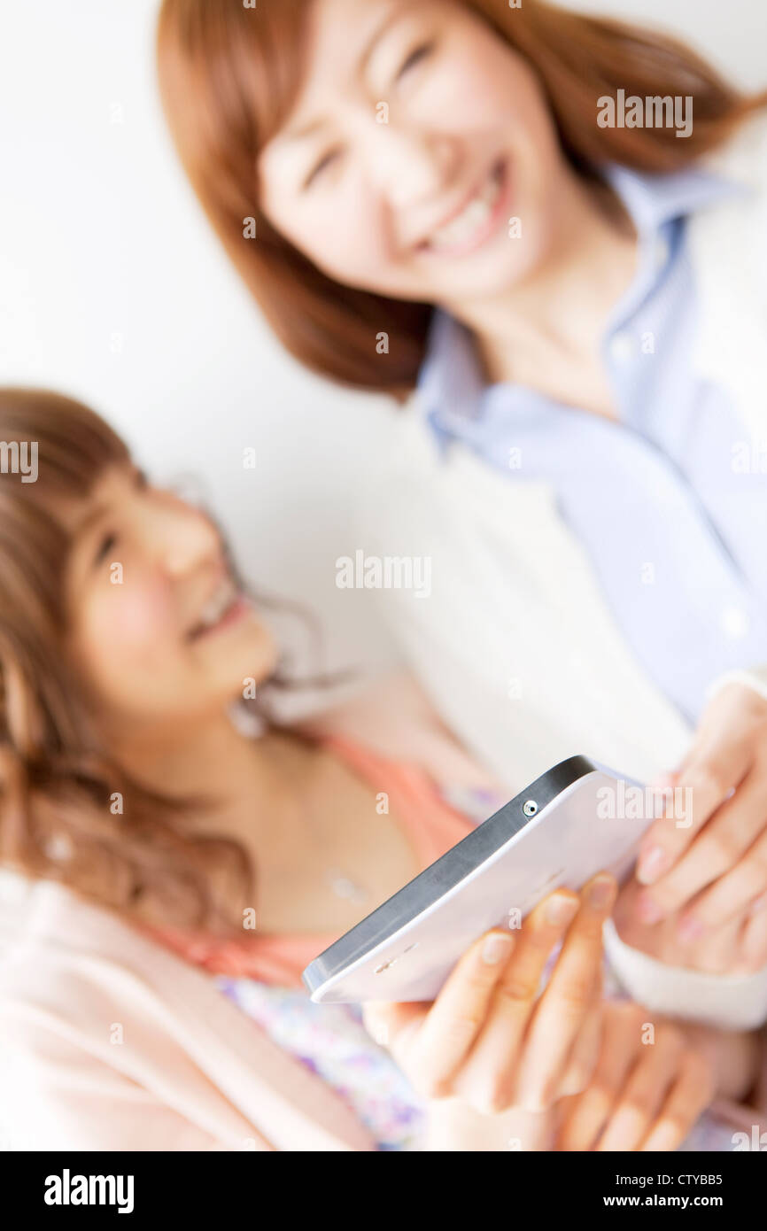 Women using digital tablet Stock Photo - Alamy