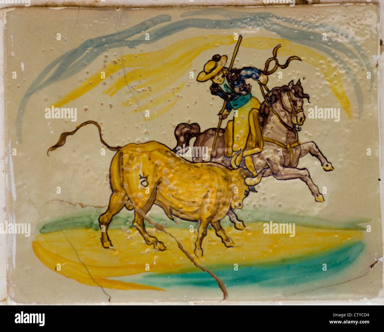 A Picador lancing a bull - a primitive painting on the wall of an old ...