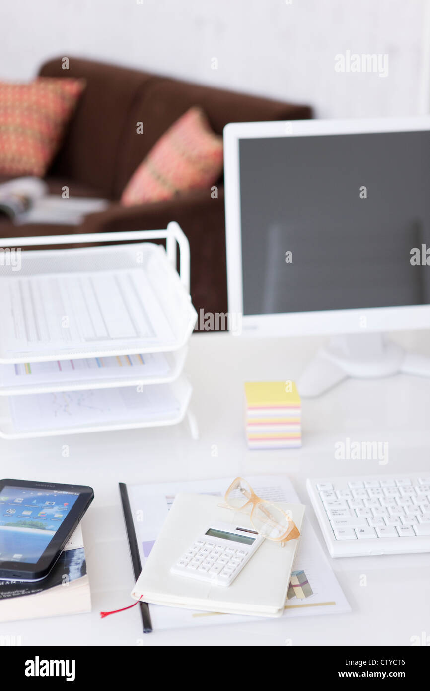 White computer on desk with eyeglasses Stock Photo - Alamy