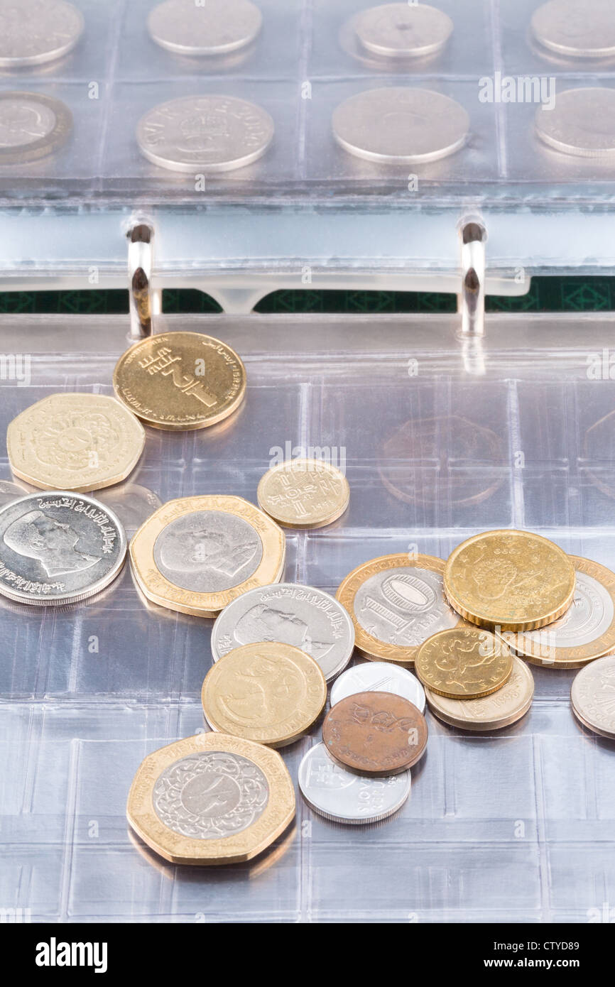 page of numismatics album with different coins Stock Photo - Alamy