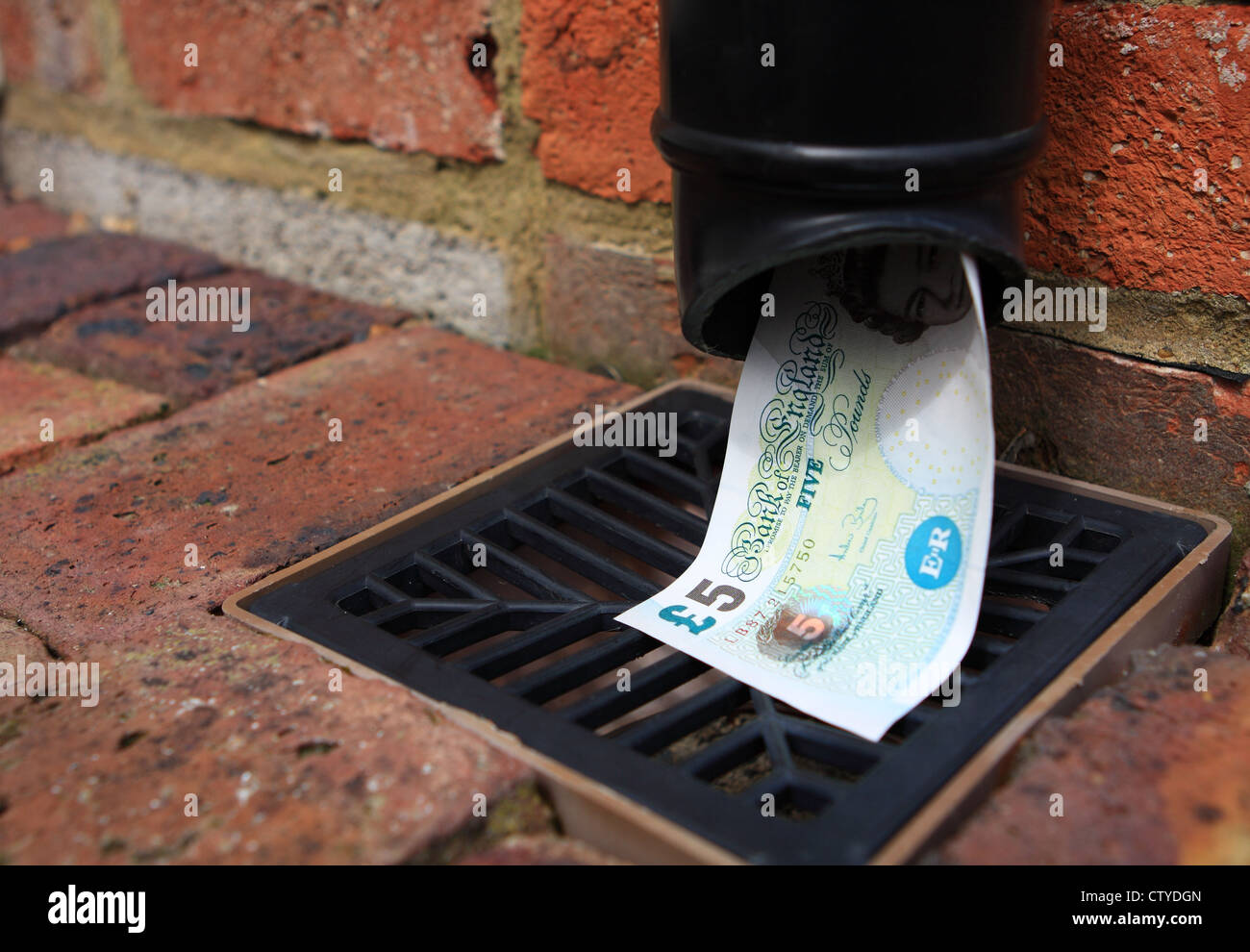 English money drain hi-res stock photography and images - Alamy