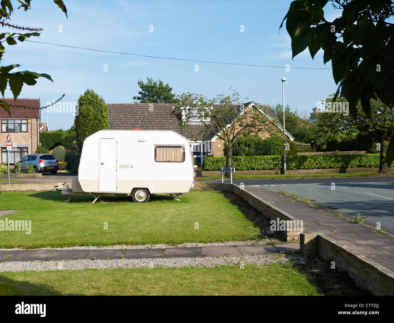 Small caravan parked in front garden of a house in Sandbach Cheshire UK ...
