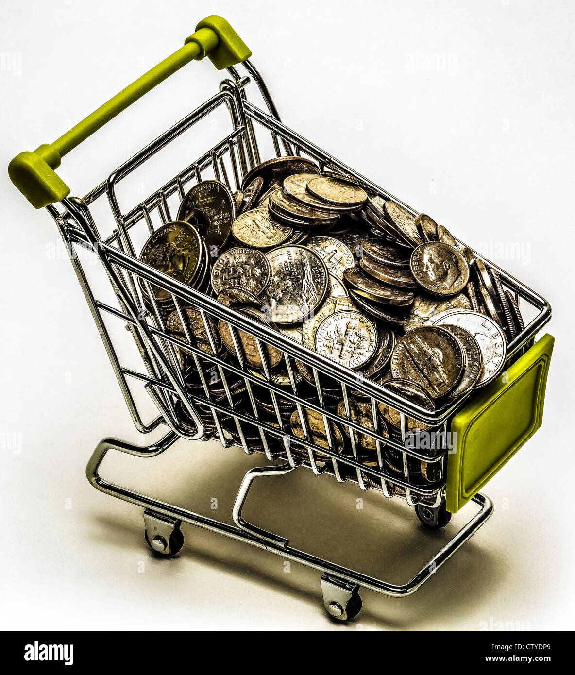 dimes, nickles, and quarters in tiny shopping cart Stock Photo - Alamy