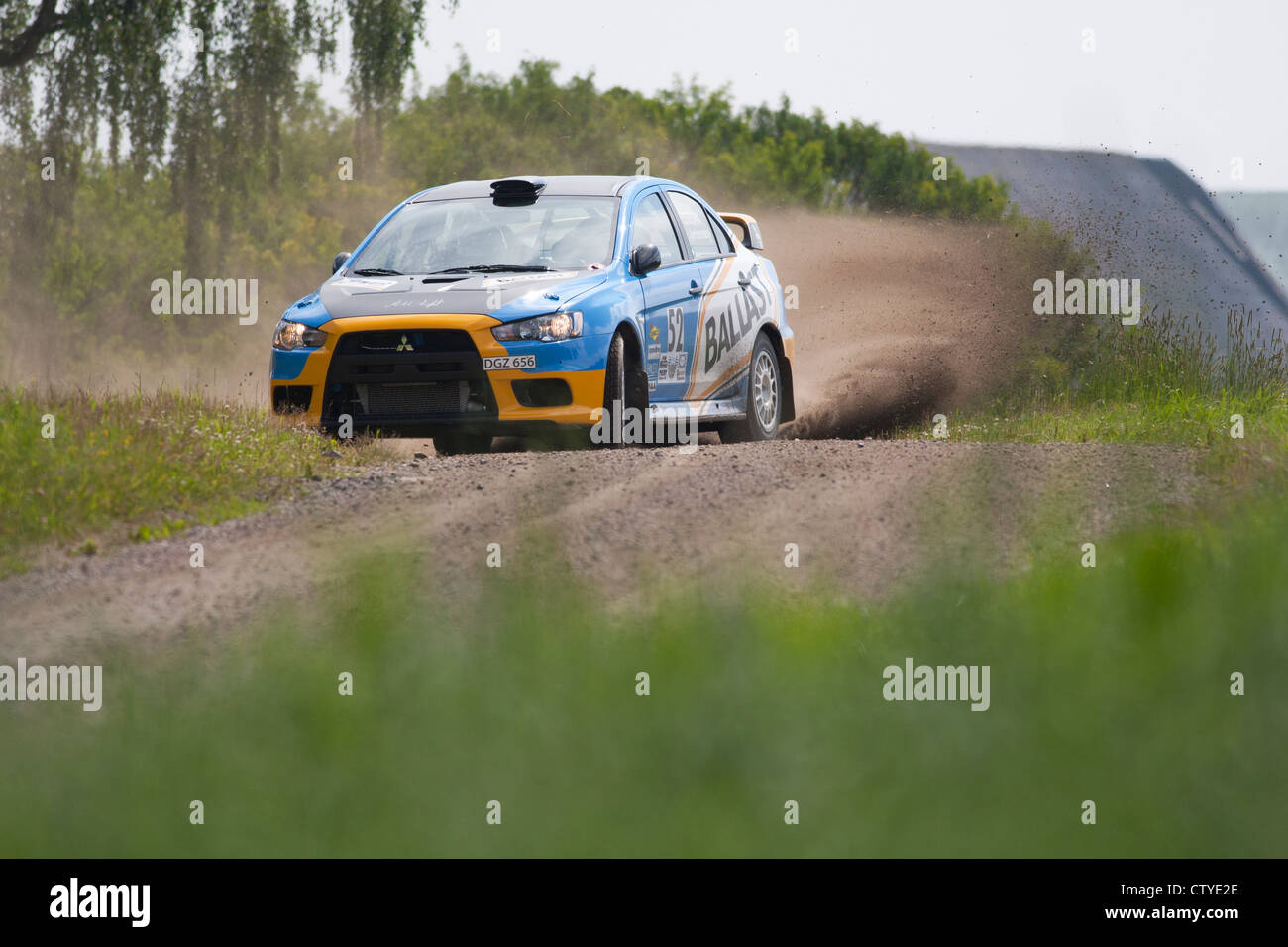 Rally car on gravel road Stock Photo - Alamy