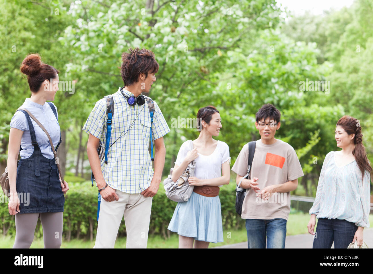 Five university students smiling Stock Photo - Alamy