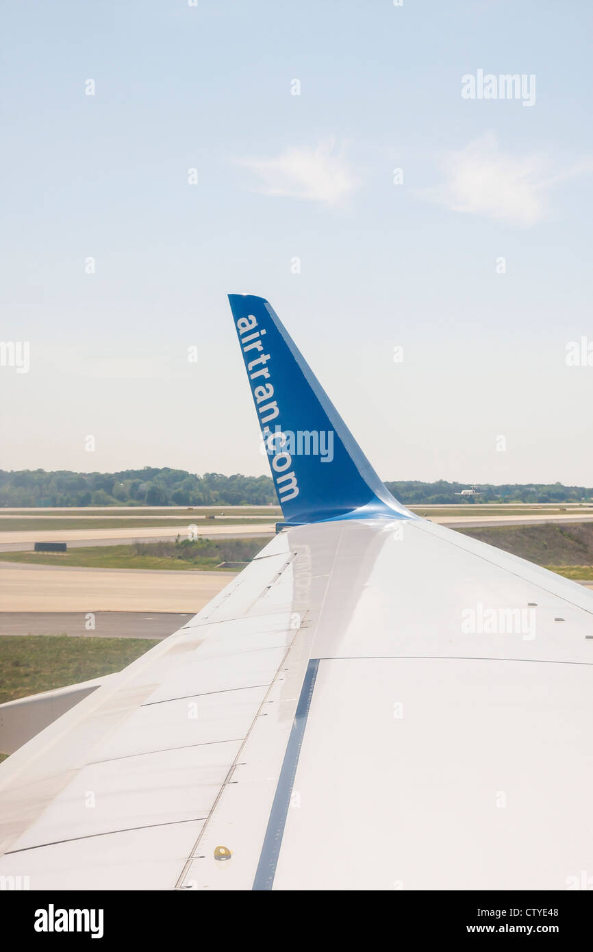 An Airtran airplace on the runway of commercial airport Stock Photo - Alamy