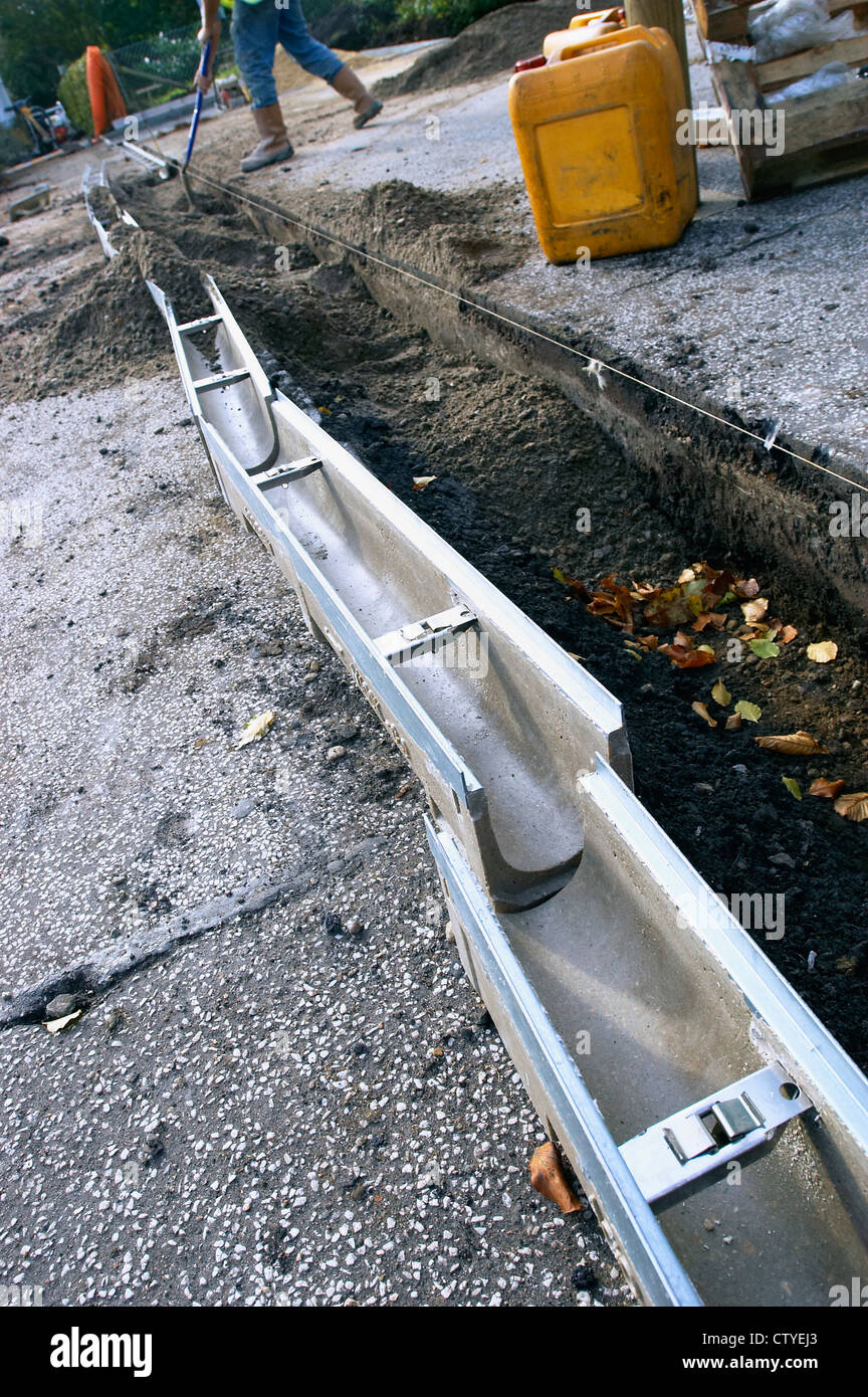 Footing drain pipes installed on pavement Stock Photo - Alamy