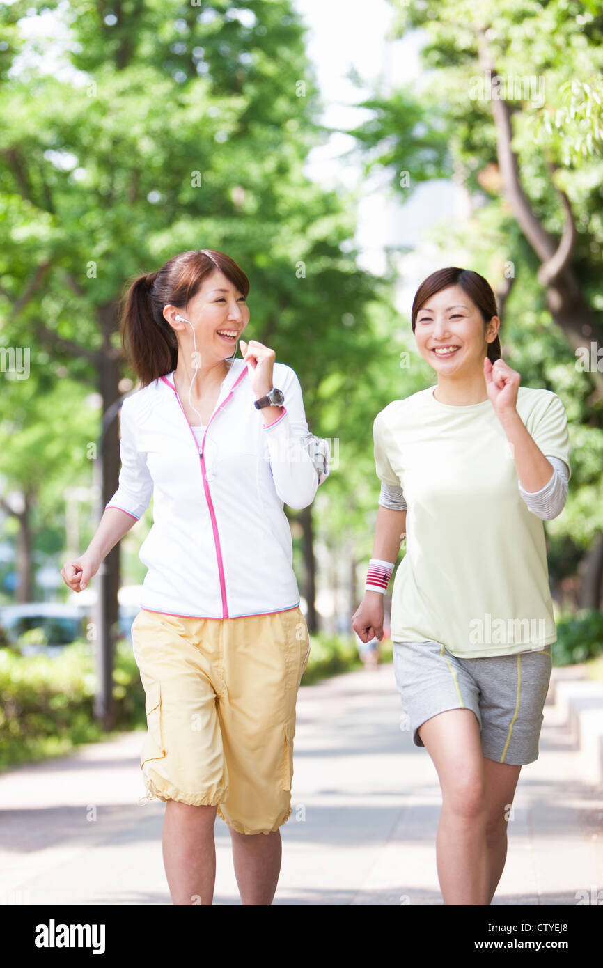 Two young women jogging Stock Photo - Alamy